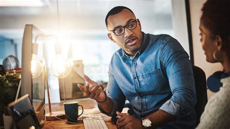 They Dont Just Talk They Do A Young Businessman And Businesswoman Having A Discussion During A