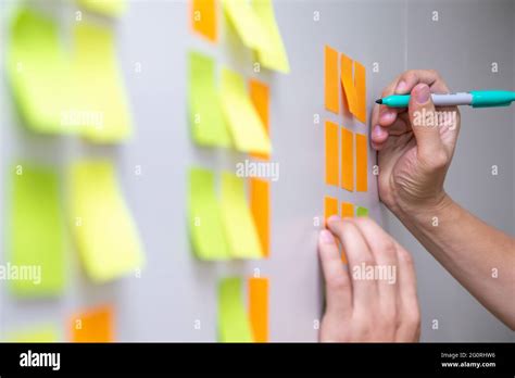 It Worker Tracking His Tasks On Kanban Board Using Task Control Of