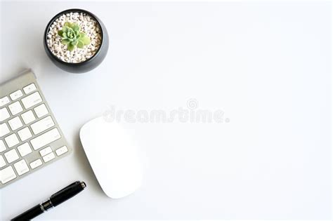 efficient workspace keyboard and mouse on white desk for seamless