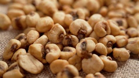 Roasted Salted Maize Kernels Falling In Slow Motion On A Rustic Sack