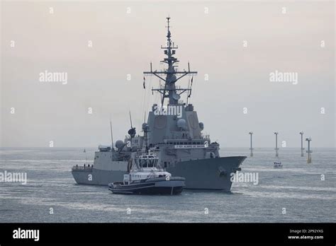 The Harbour Tug Tempest Close To The Bow Of The Spanish Navy Guided Missile Frigate Alvaro De