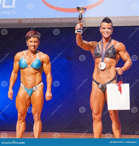 Female Bodybuilders Celebrate Their Championship Victory On Stage