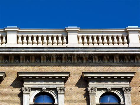 Old Brick Building Elevation Detail With Arched Windows And Stone Trim