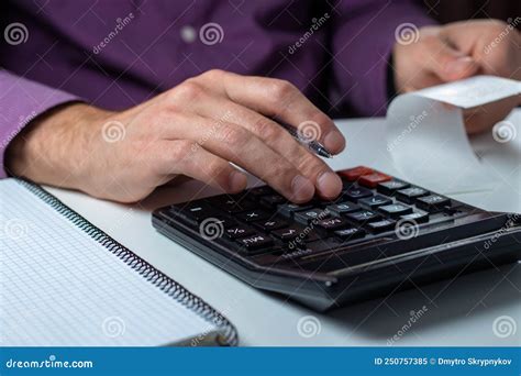 Man Calculates The Budget Shopping Cart A On Table With Calculator And Paper Stock Image