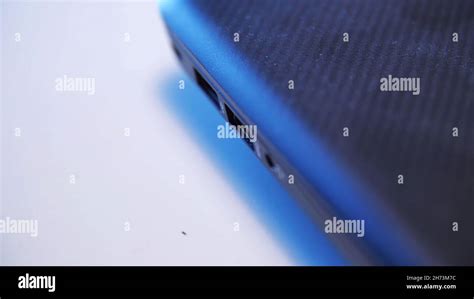 Process Of Charging Device With A White Usb Cable Close Up Of Male