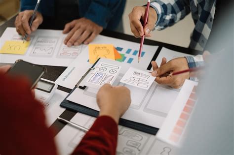 Premium Photo Ui Designer Brainstorming About Mobile App Interface