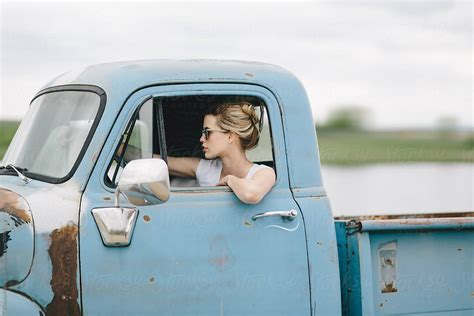Blond Girl Driving An Old Pickup Truck By Stocksy Contributor A