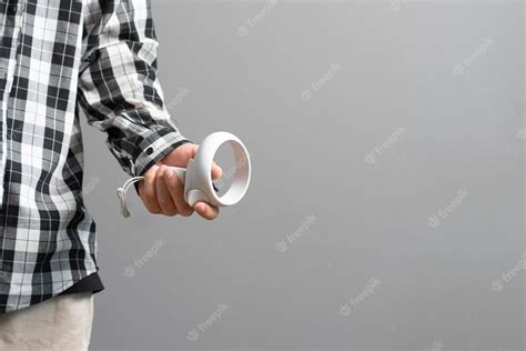 premium photo a gamer holding a wireless joystick controller pushing