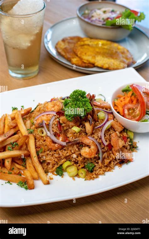 Tasty Sea Food Rice With Shrimp And Fries Side Of Salad And Fried