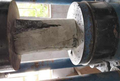 12 Placing Cylindrical Specimen For Compressive Strength Testing