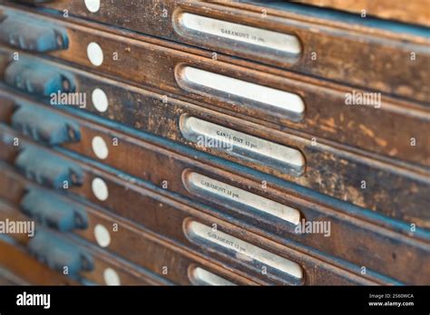 A Wooden Drawer Containing Vintage Metal Printing Type Showing Detailed