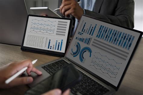Premium Photo Two Businessman Data Analysis Profit On The Computer