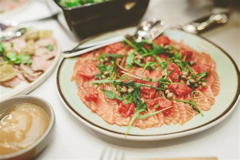Inviting Table Filled With An Array Of Delicious Food Items Including