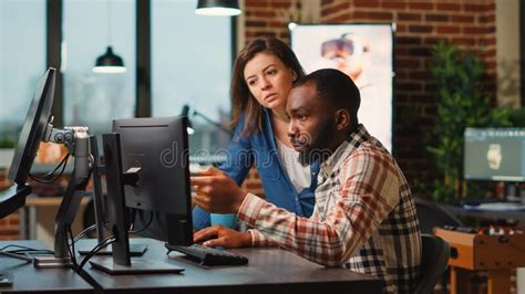 team of professional developers working on software development stock