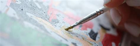 Premium Photo Female Hand Drawing Picture By Numbers With Brush And Paint Closeup