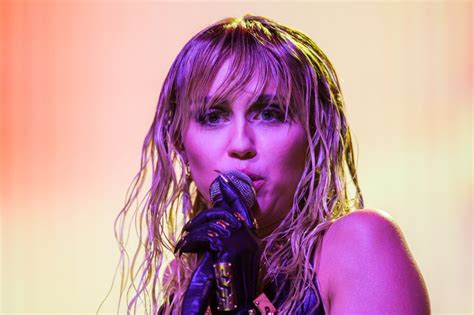 Miley Cyrus Dazzles With Bleached Eyebrows And Glamorous Gown The