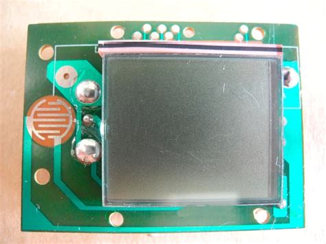 Premium Photo Miniature Lcd Panel On The Motherboard Detail Of An