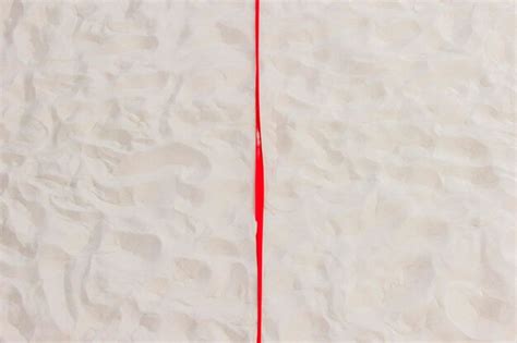 Premium Photo High Angle View Of Red Boundary Line At Beach