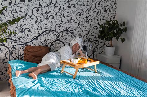 A Man And Home Spa Care At Home Takes Care Of Himself And Smears His Face With Cream Does A ...