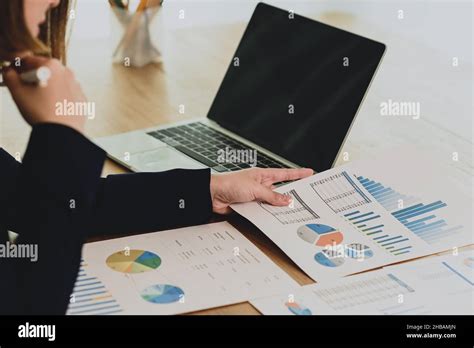 Business Woman Analyzing Business Data From The Graph Female Executive Looking At The Data