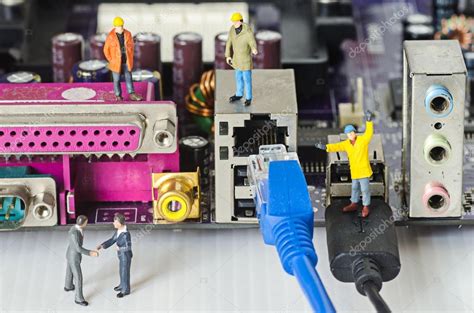 Miniature Engineer Team Try To Connect Ethernet Cables To Port — Stock