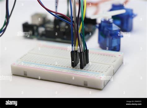 Breadboard With Jumper Wires Connected Along With Arduino Uno And Micro
