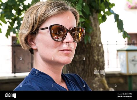 Dreamy Portrait Of A Yo White Woman In Summer Dress Reading A Book