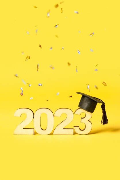 Premium Photo Class Of 2023 Concept Wooden Number 2023 With Graduated Cap On Colored Background
