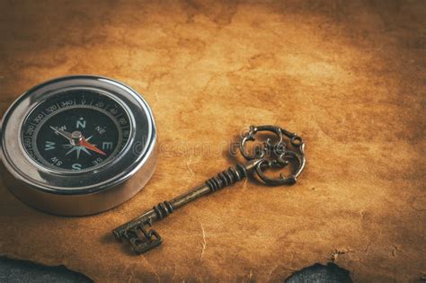 Vintage Compass And Key On Old Paper Background Retro Style Stock