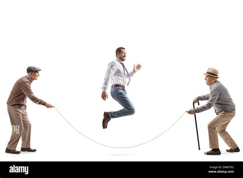 Full Length Shot Of Two Senior Men Playing Skipping Rope With A Younger