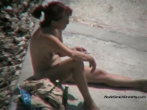 Hot Brunette Gets Wet Before Jumping Into The Water