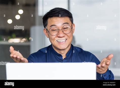 Close Up Photo Of Successful Asian Businessman Talking Remotely On Video Call Male Boss In