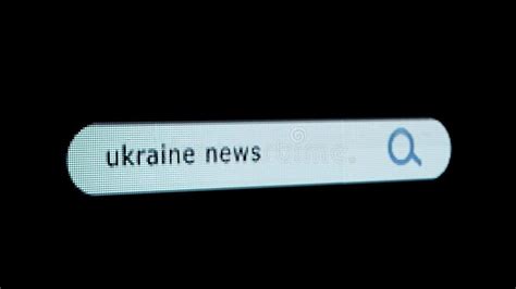 shot of monitor screen pixel screen with animated search bar keywords ukraine news typed in