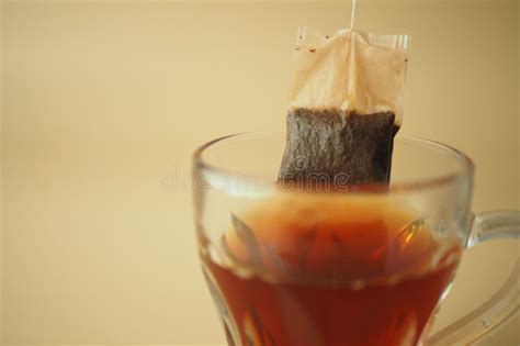 Cup Of Tea With Tea Bag On Wooden Table Close Up Stock Photo Image Of Black Brown