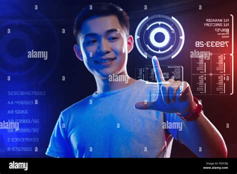Happy Web Developer Touching A Round Hologram On The Screen And Smiling
