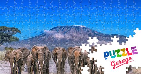 Elephants With Mount Kilimanjaro In The Background Jigsaw Puzzle