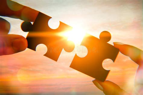 Business Person Hand Holding Puzzle Piece Closeup Part Of Two Jigsaw