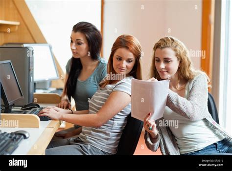 Babe Showing Her Notes To Her Classmate Stock Photo Alamy