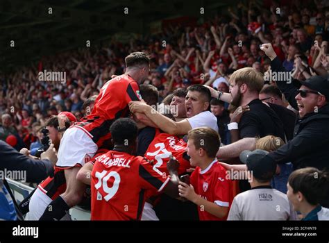 Morecambes Daniel Ogwuru Obscured Celebrates With The Fans After Scoring His Sides Second