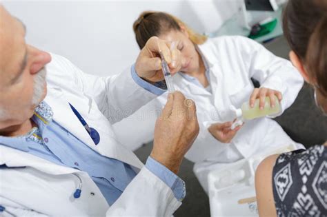 Doctor Preparing An Injection Stock Image Image Of Disposable