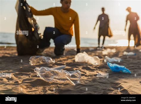 Earth Day Volunteers Activists Collects Garbage Cleaning Of Beach Coastal Zone Woman Mans With