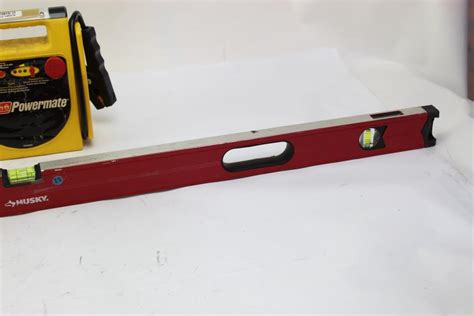 Husky 48 Level And Coleman Jumpstarter Property Room