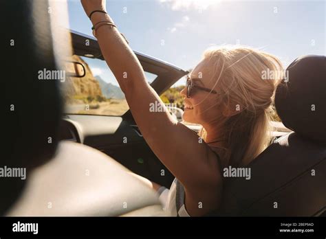 Beautiful Woman Enjoying On A Road Trip Female Sitting In Front