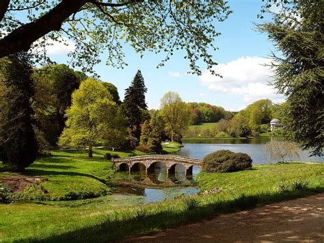Brown Concrete Arch Bridge Grass Trees Bridge Lake Pond People