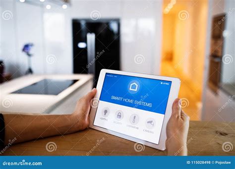 Male Hands Holding A Tablet With Smart Home Screen Stock Photo Image
