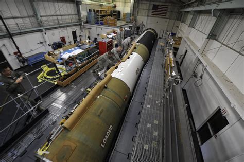 U S Air Force Airmen Install A Cable Raceway On An Intercontinental