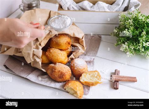 Female Hand Sprinkles Powdered Sugar On Donuts Cottage Cheese Round Donuts Pile Covered Up With