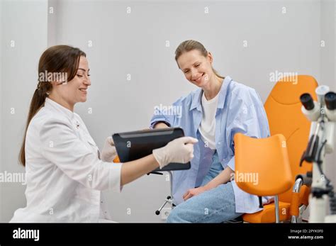 Doctor Gynecologist Showing Result Of Medical Exam To Patient Stock