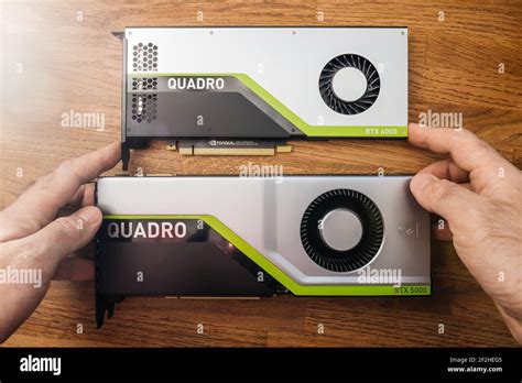 Senior Engineer Hands Pov Holding Looking Comparing Two New Gpu Nvidia
