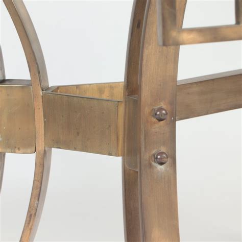 A French Modern Solid Bronze Dining Table Having A Glass Top C 1940